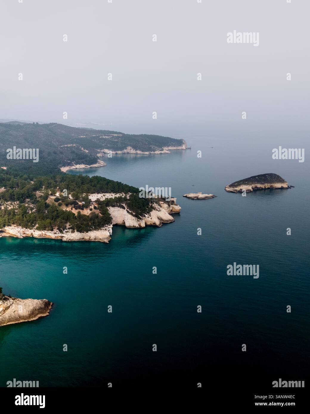 Aerial view of the idyllic coastline with cliffs and a beautiful cove ...