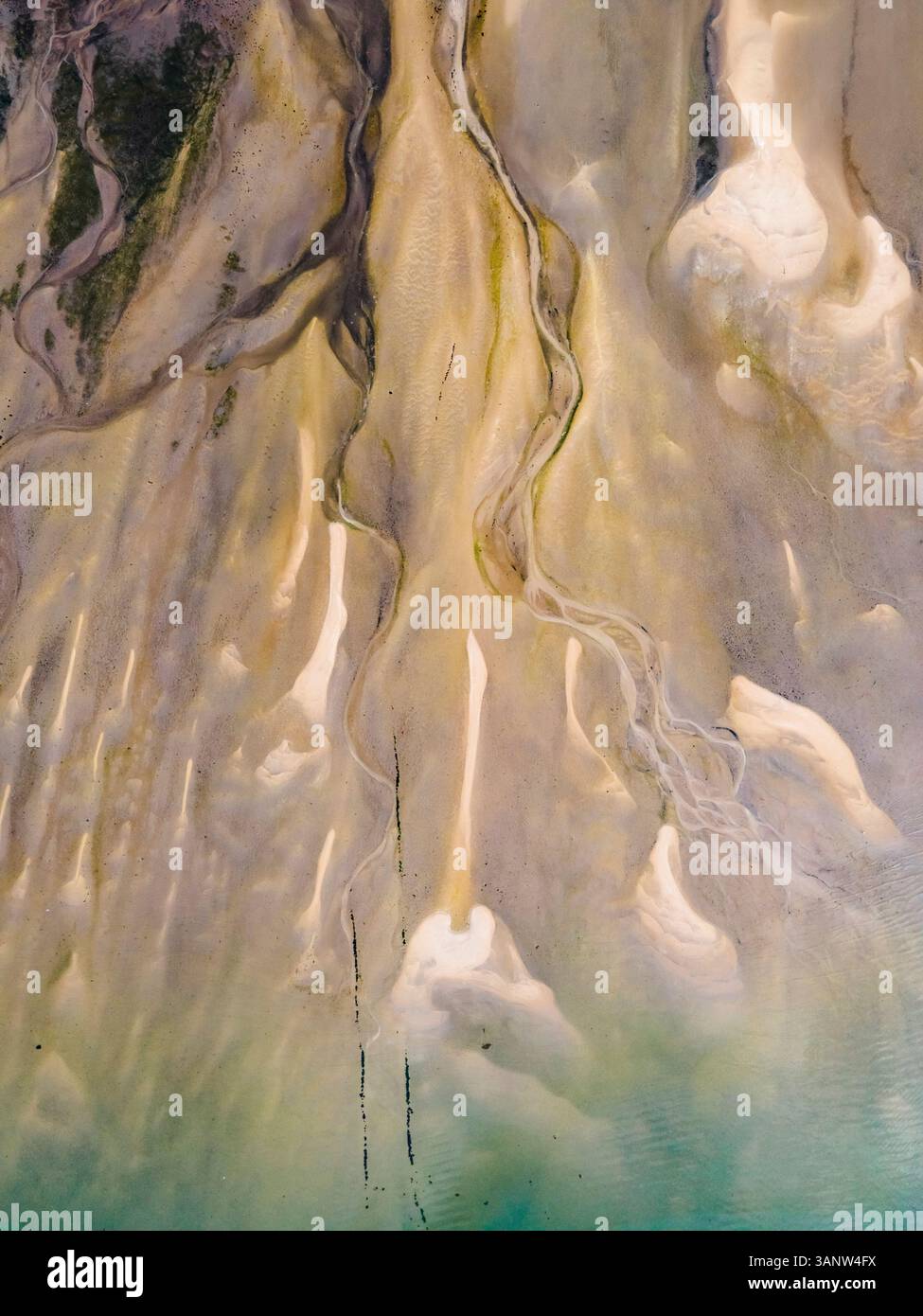 Aerial view of serene coastal patterns and dynamic water flow with ...