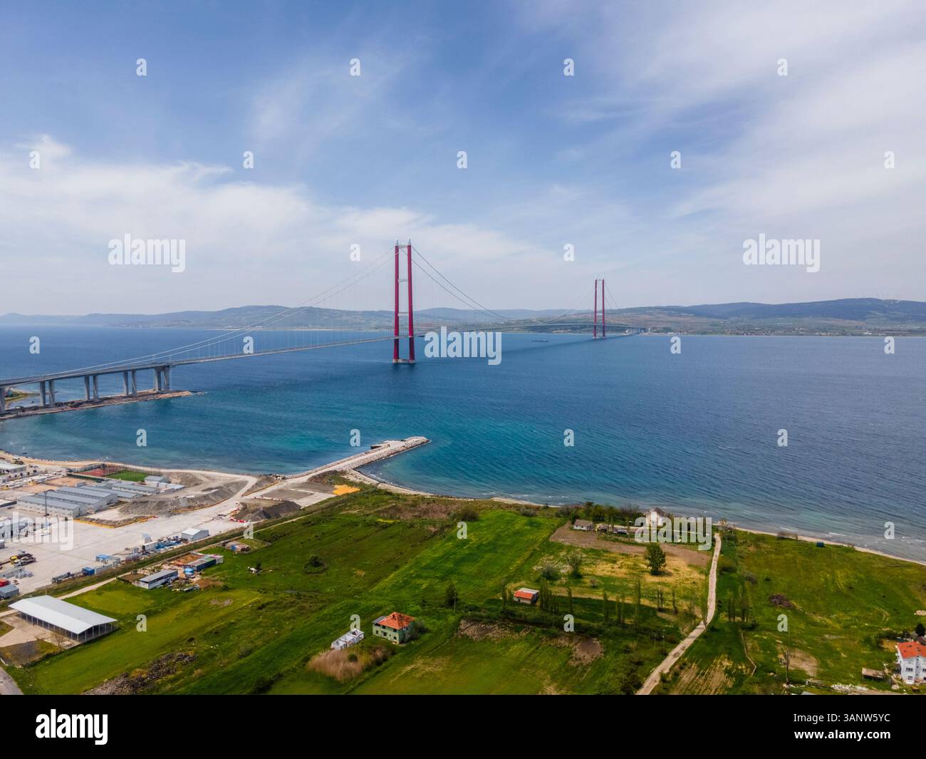 Aerial view of a beautiful suspension bridge over a tranquil sea ...