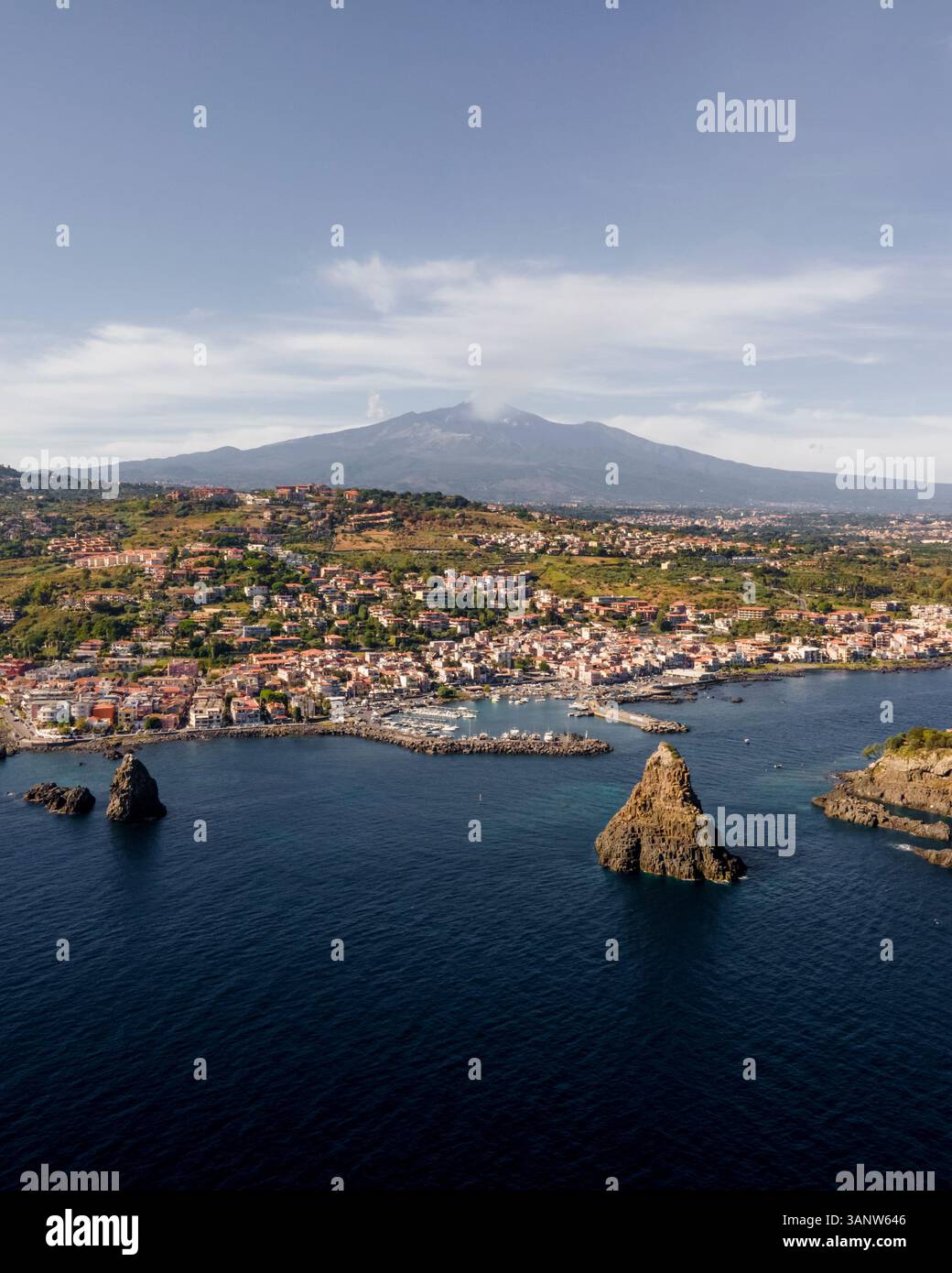 Aerial view of the beautiful coastal town with boats in the harbour and ...