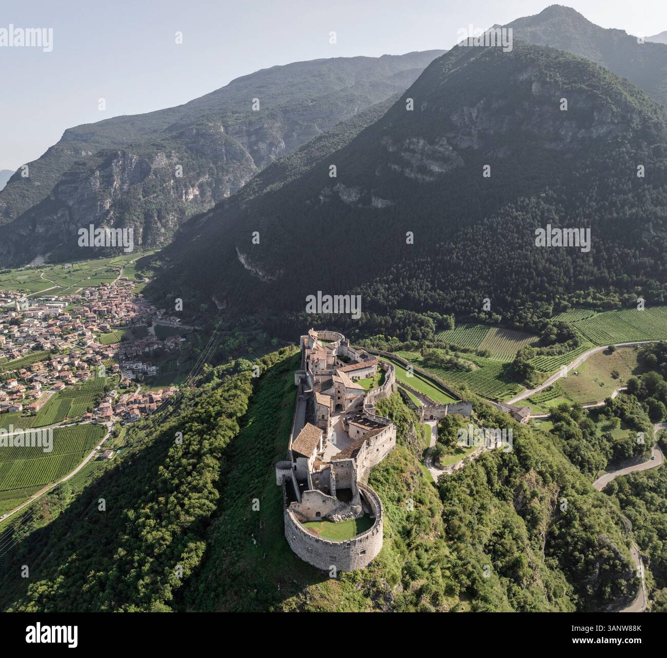 Aerial view of the majestic Castel Beseno on a hilltop surrounded by ...