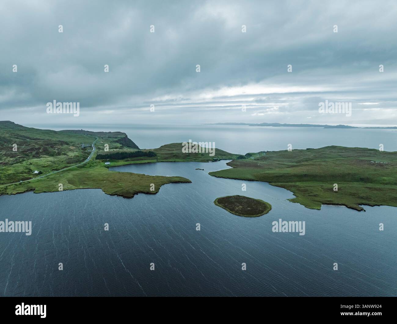 Aerial view of tranquil Loch Leathan surrounded by lush greenery and ...
