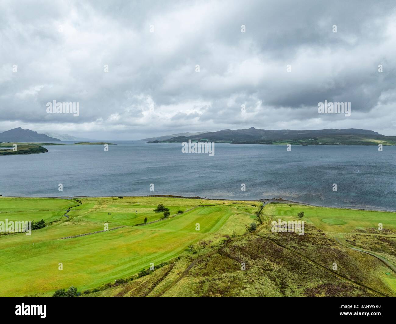Aerial view of Loch Sligachan surrounded by majestic mountains and ...