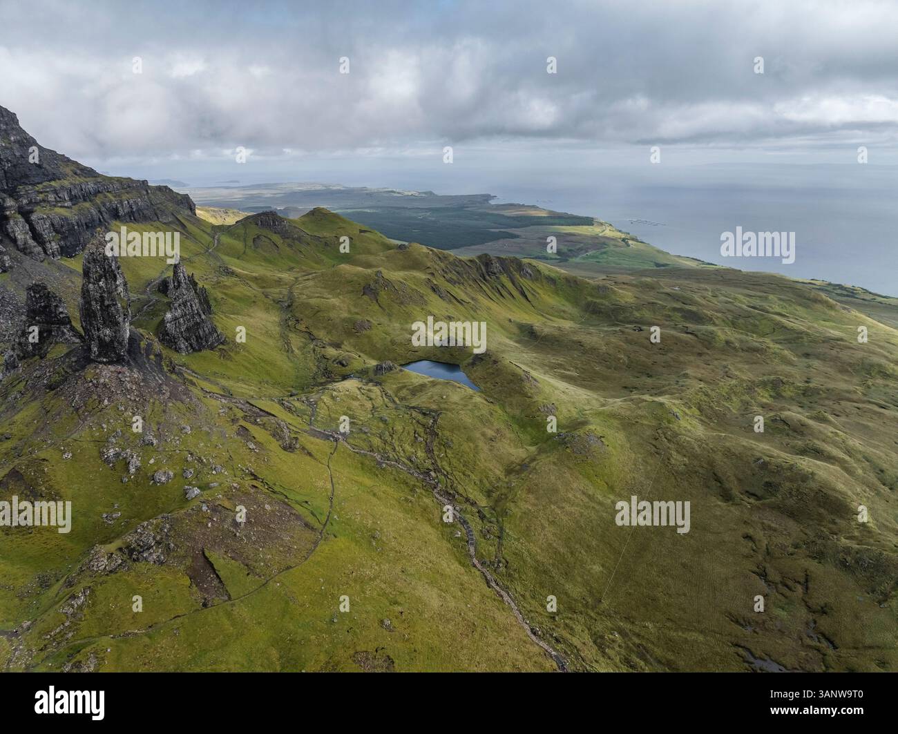Aerial view of the majestic Old Man of Storr amidst rugged mountains ...