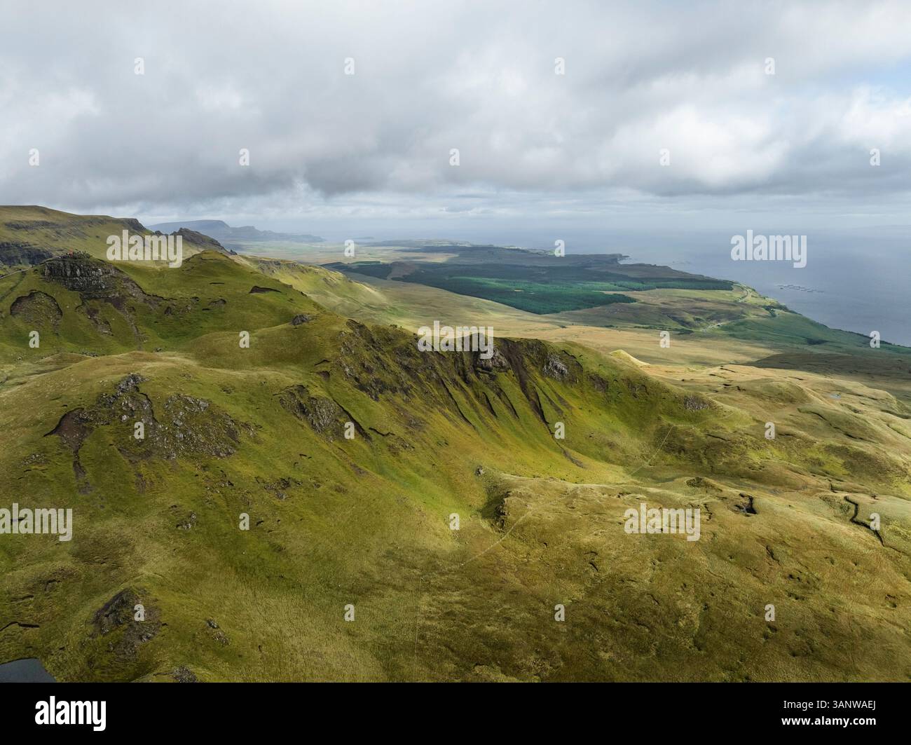 Aerial view of the majestic Old Man of Storr surrounded by rugged hills ...