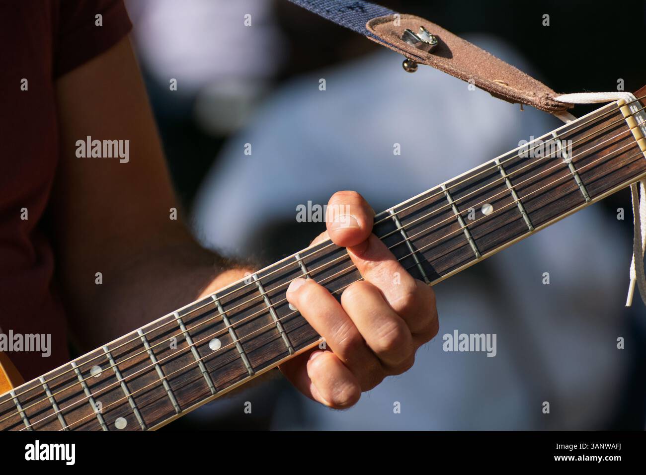 Close-up of hands playing acoustic guitar fretboard Stock Photo - Alamy
