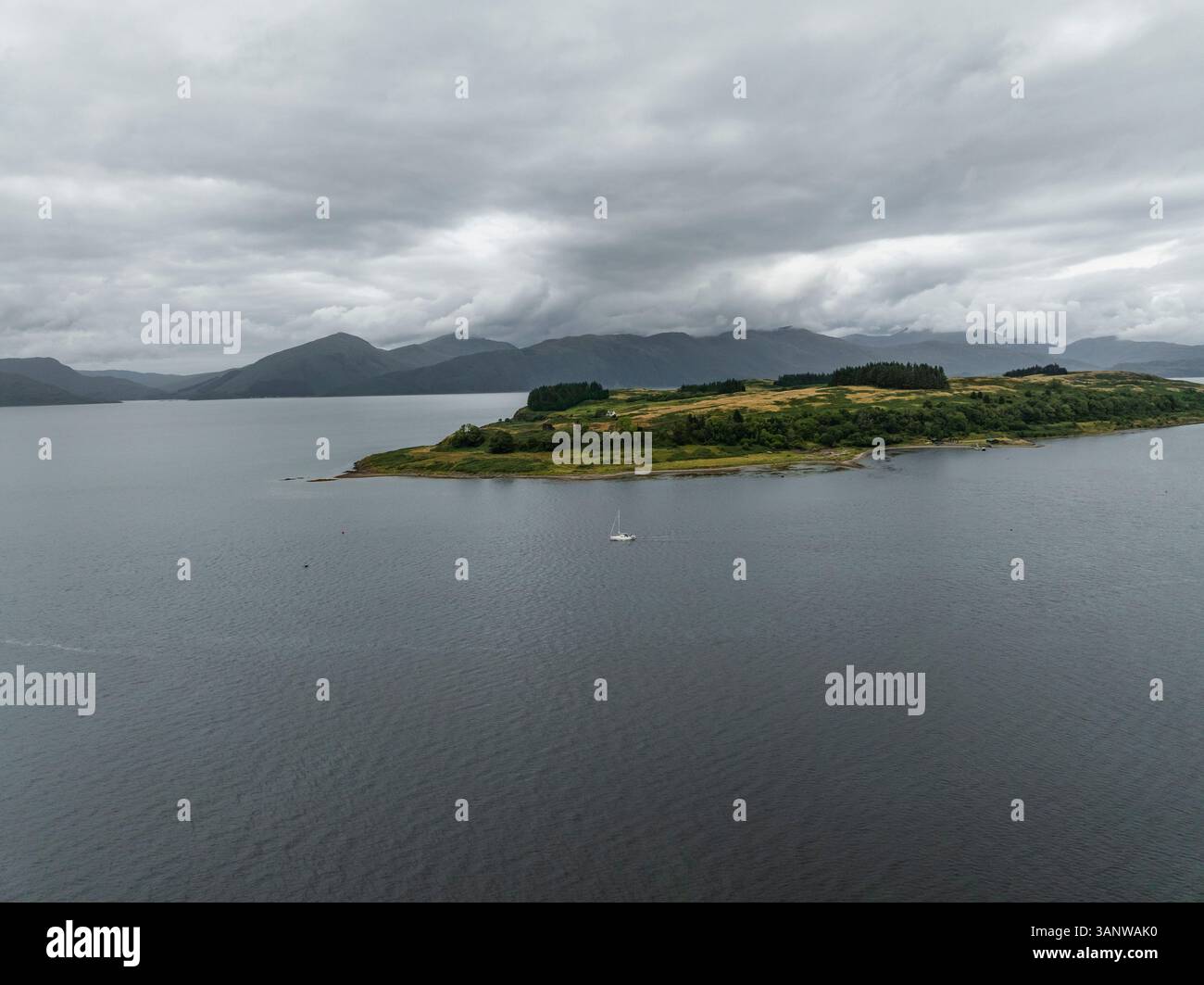 Aerial view of Shuna Island on Loch Linnhe with a serene boat and ...