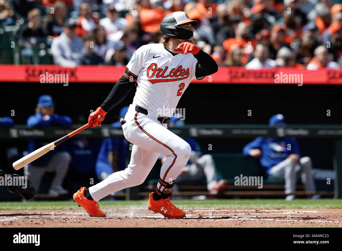 Baltimore Orioles' Gunnar Henderson (2) follows through on his swing ...
