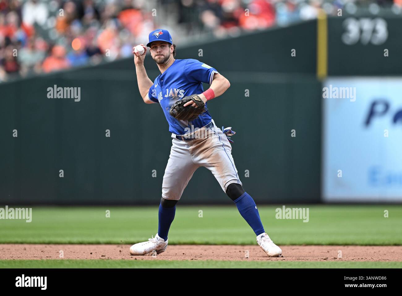 Toronto Blue Jays third baseman Ernie Clement throws to first base for ...