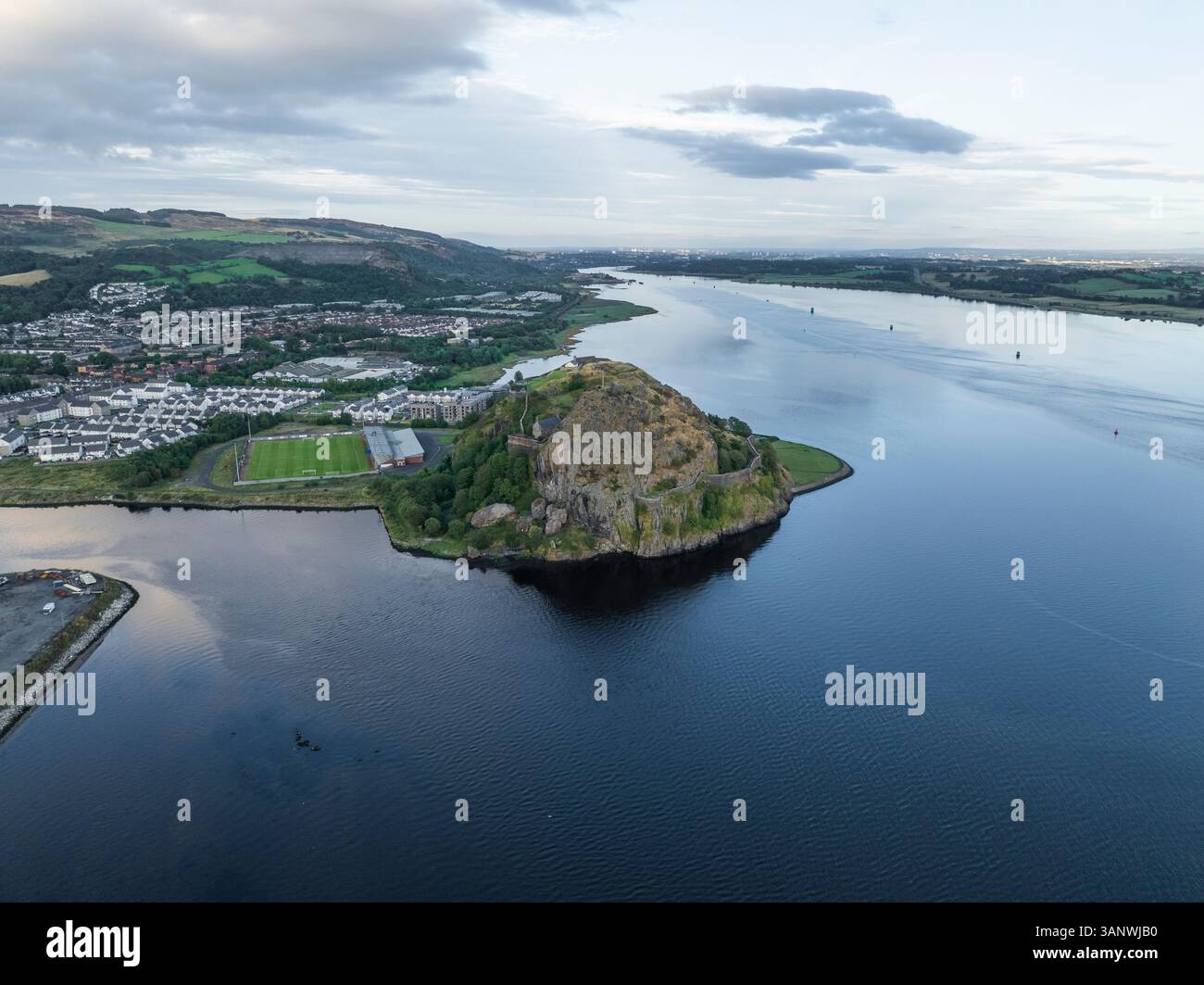 Aerial view of the serene River Clyde with Dumbarton Castle surrounded ...