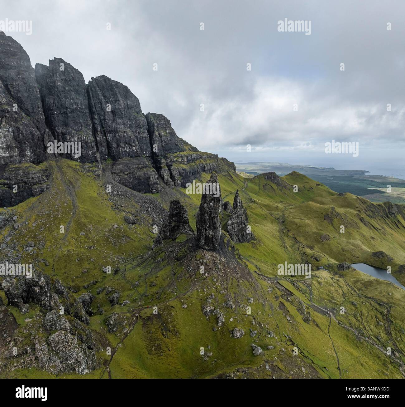 Aerial view of the iconic old man of storr amidst rugged cliffs and ...