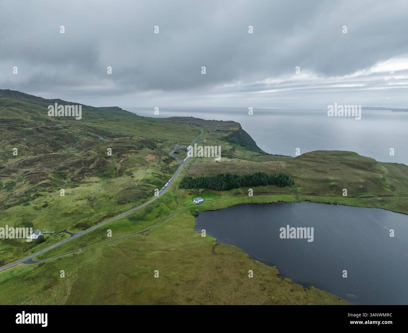 Aerial view of tranquil Loch Leathan surrounded by scenic greenery and ...