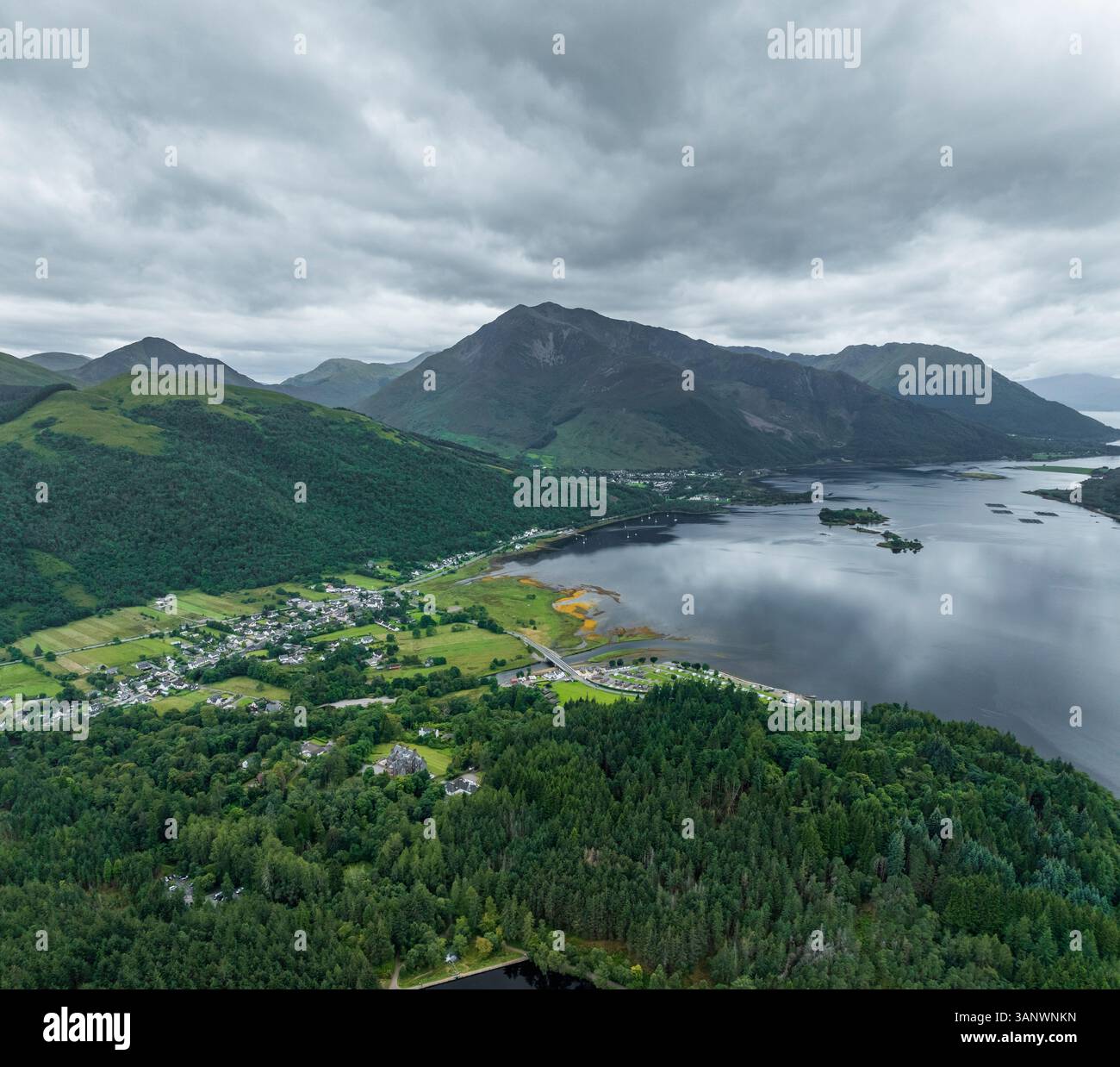 Aerial view of Loch Leven surrounded by majestic mountains and lush ...