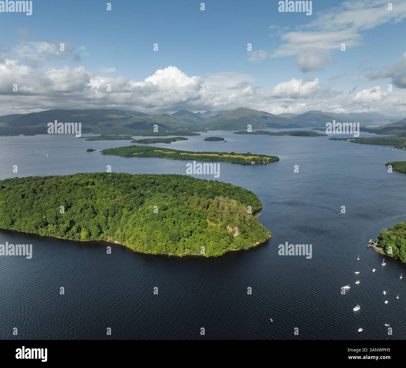 Aerial view of serene Loch Lomond with picturesque islands and majestic ...
