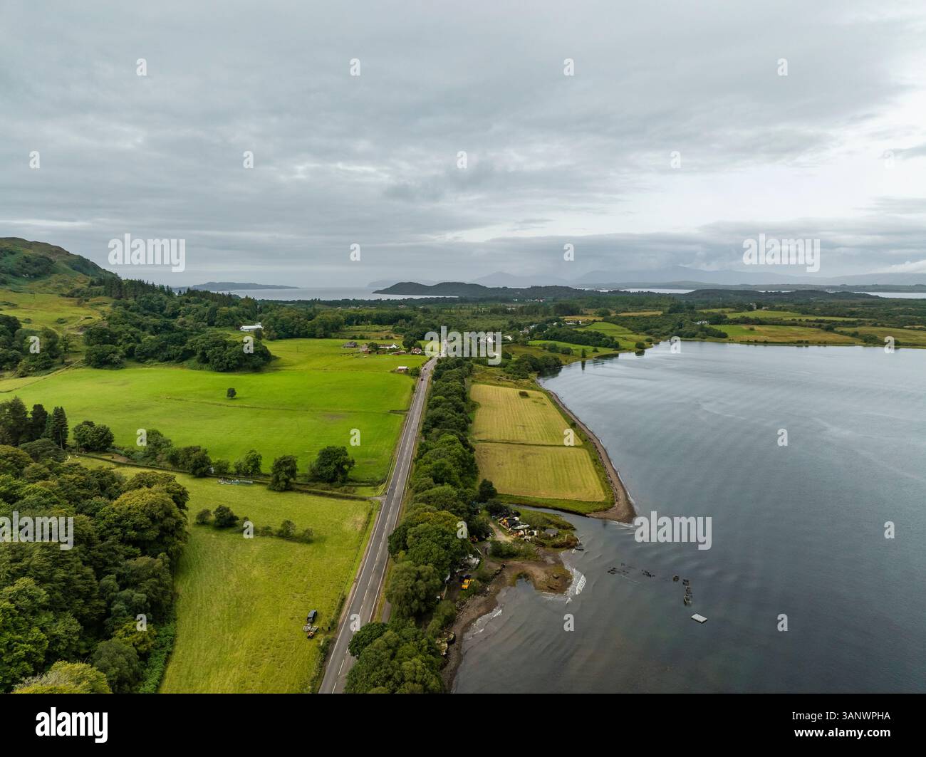 Aerial view of serene Loch Creran surrounded by lush greenery and hills ...