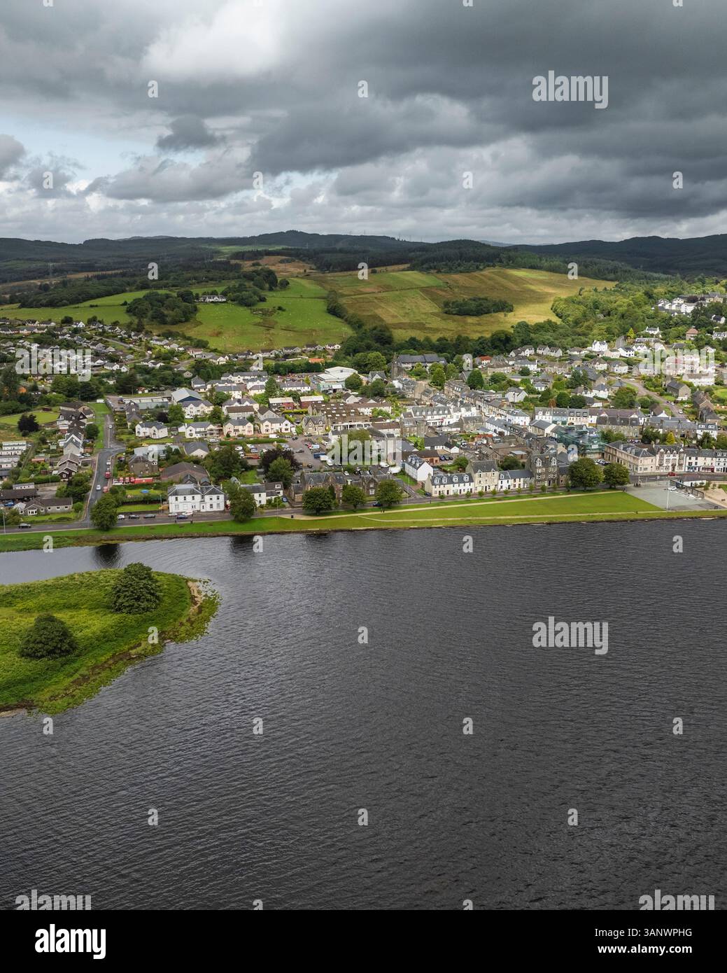 Aerial view of Loch Fyne with picturesque hills and a tranquil town ...