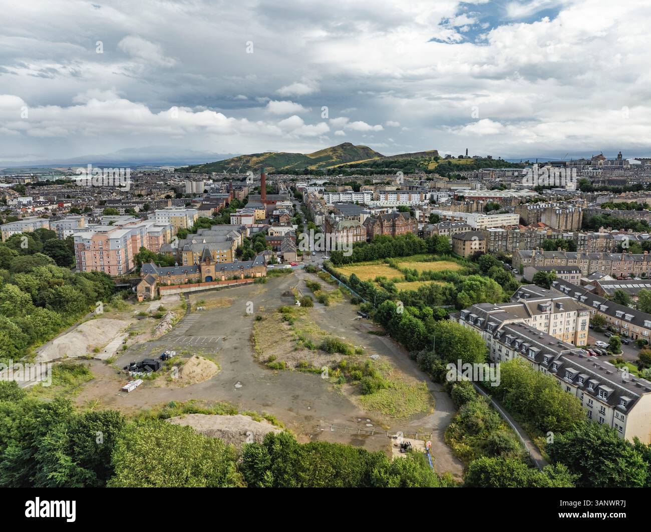 Aerial view of beautiful cityscape featuring Arthur Seat volcano ...
