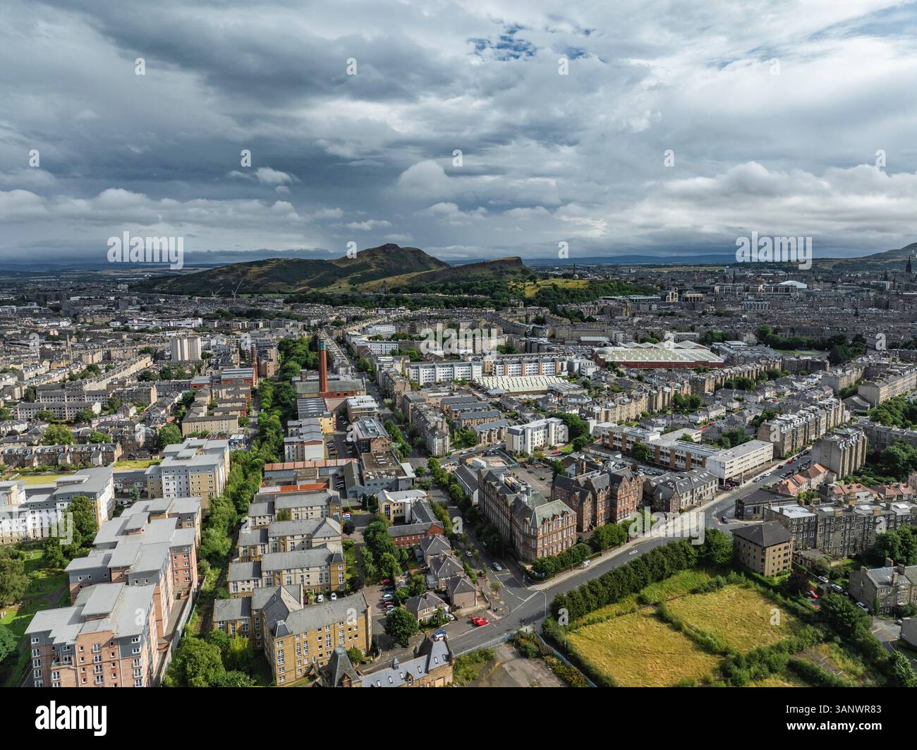 Aerial view of beautiful Edinburgh cityscape with Arthur Seat volcano ...