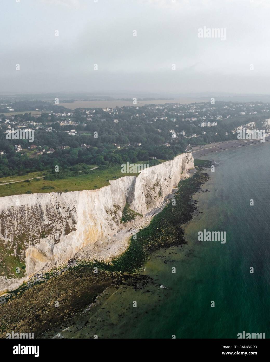 Aerial view of the iconic white cliffs of Dover along the rugged ...