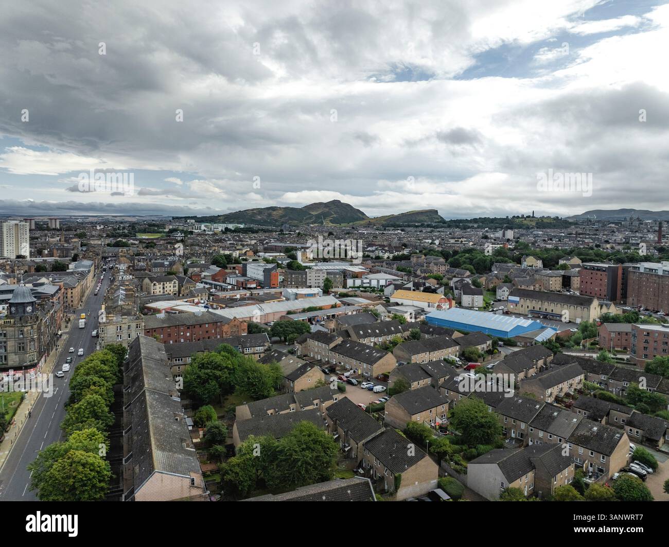 Aerial view of urban landscape with Arthur Seat volcano and residential ...