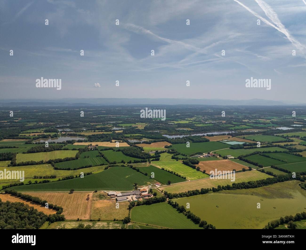 Aerial view of expansive farmland and picturesque fields under a clear ...