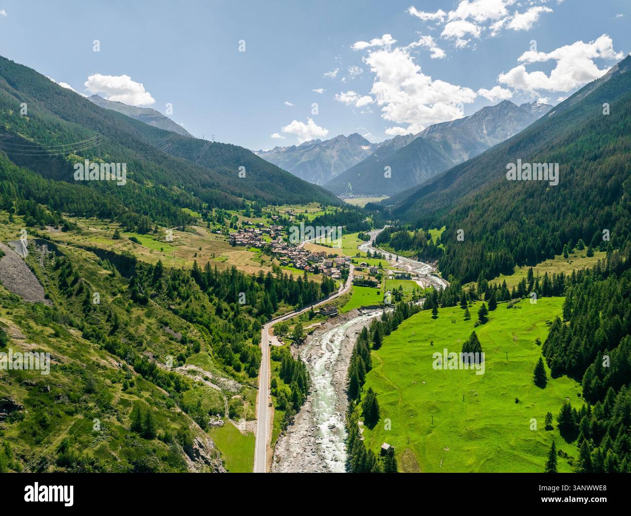 Aerial view of beautiful alpine landscape with mountains, lush valley ...