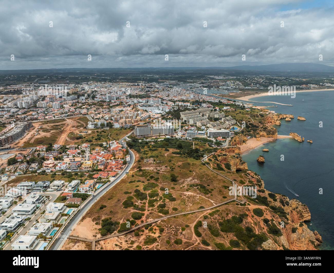 Aerial view of coastal town Lagos with beautiful bay and residential ...