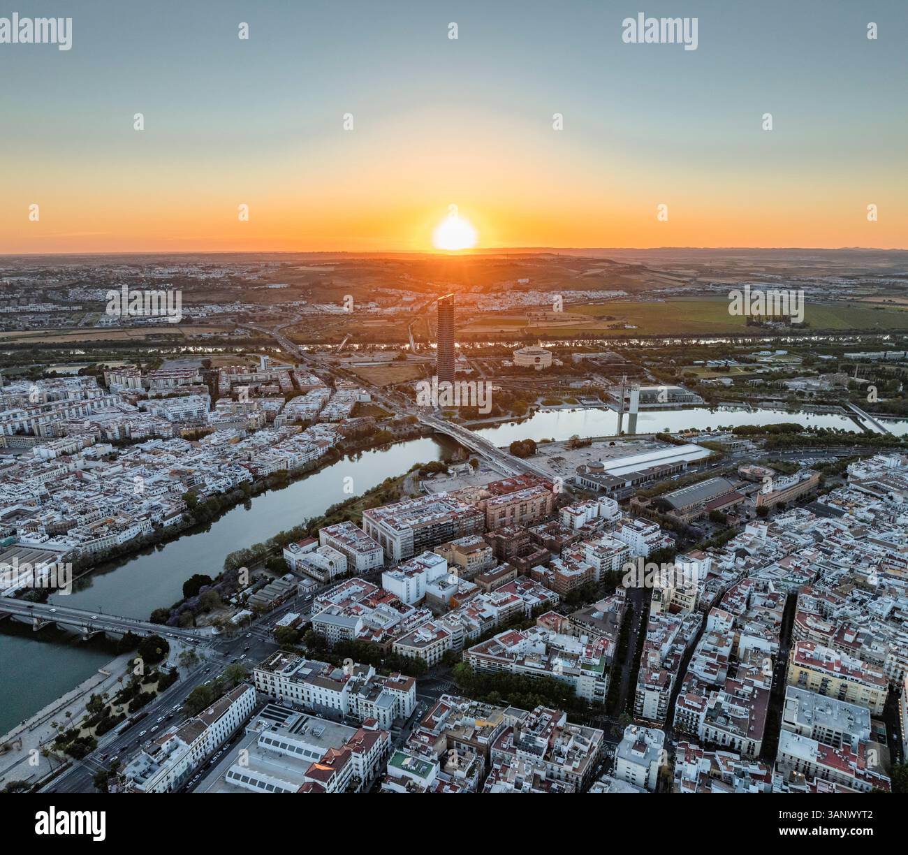 Aerial view of historic Seville city along Guadalquivir river, Seville ...