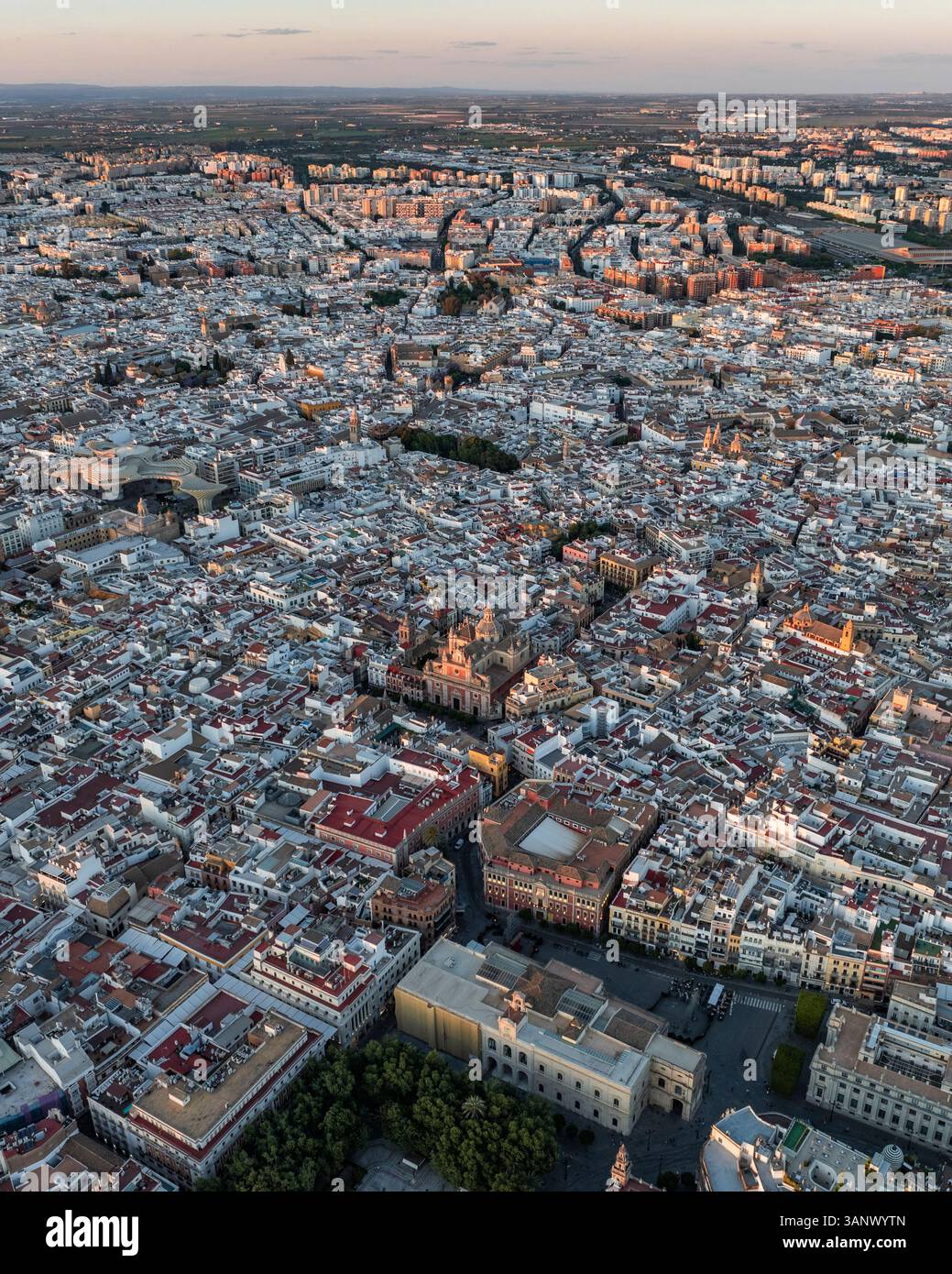 Aerial view of historic old town rooftops at sunset, Seville, Andalusia ...