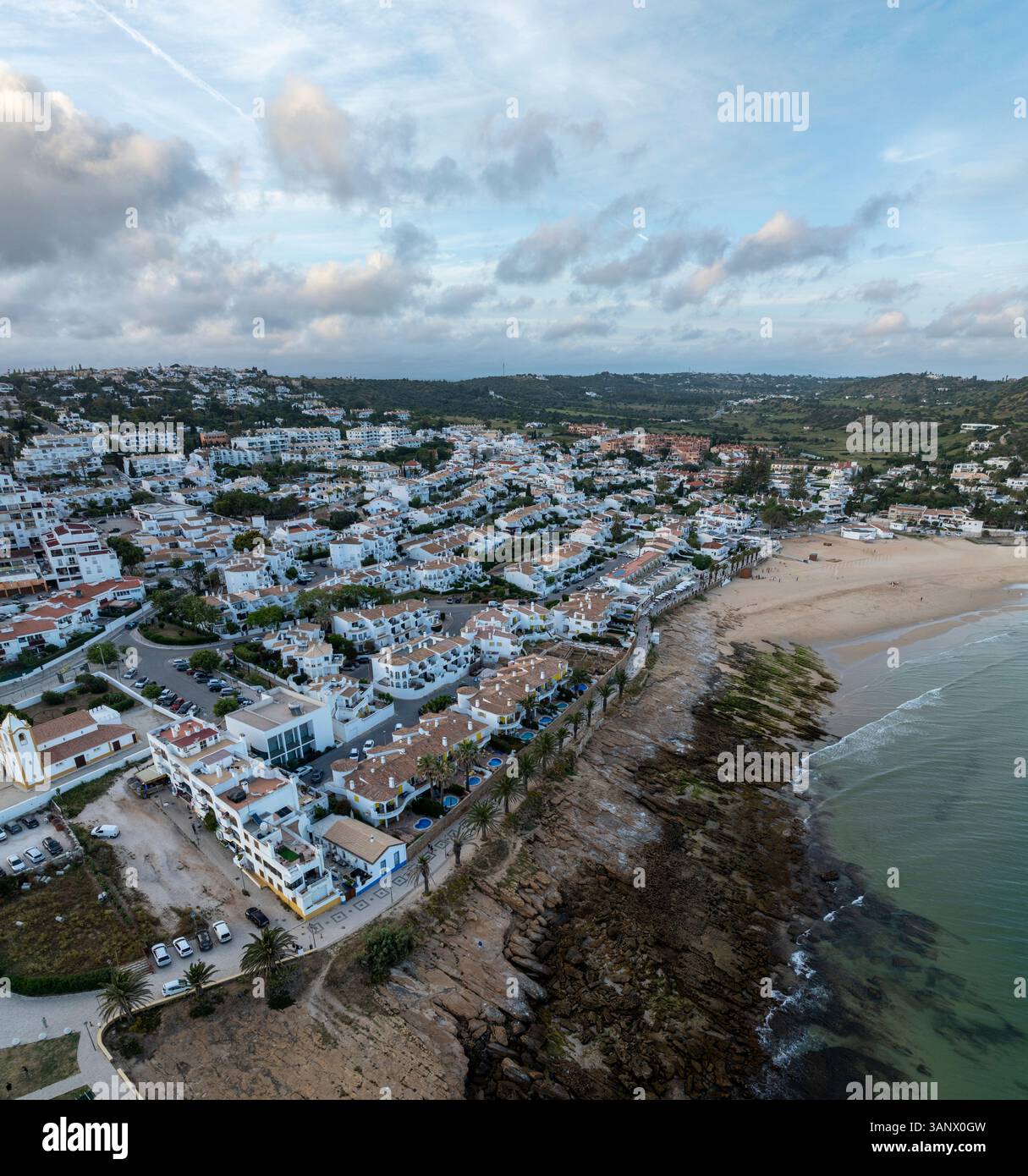 Aerial view of beautiful coastal town with sandy beach and stunning ...