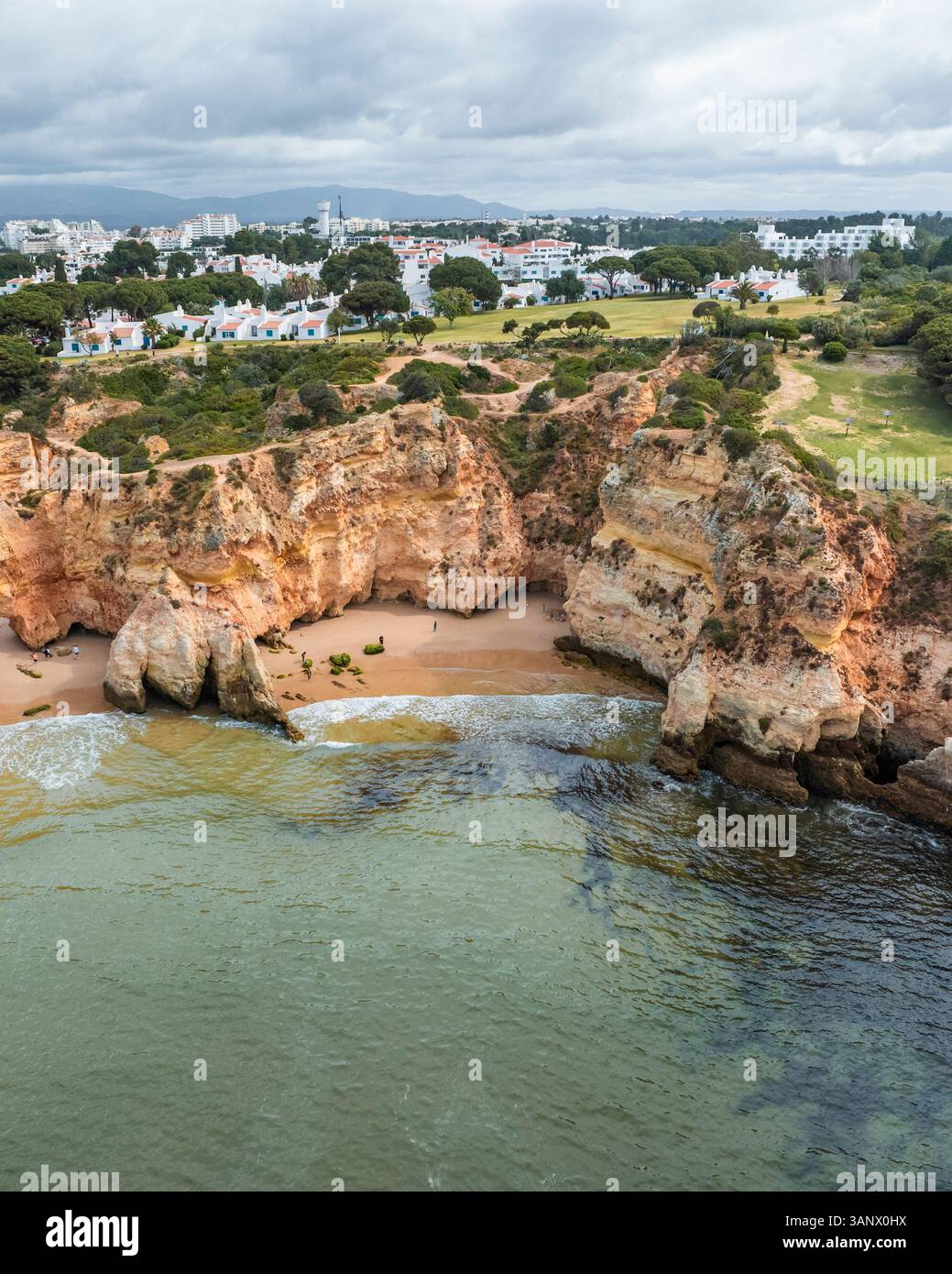 Aerial view of beautiful coastal cliff at Praia dos Tres Irmaos ...