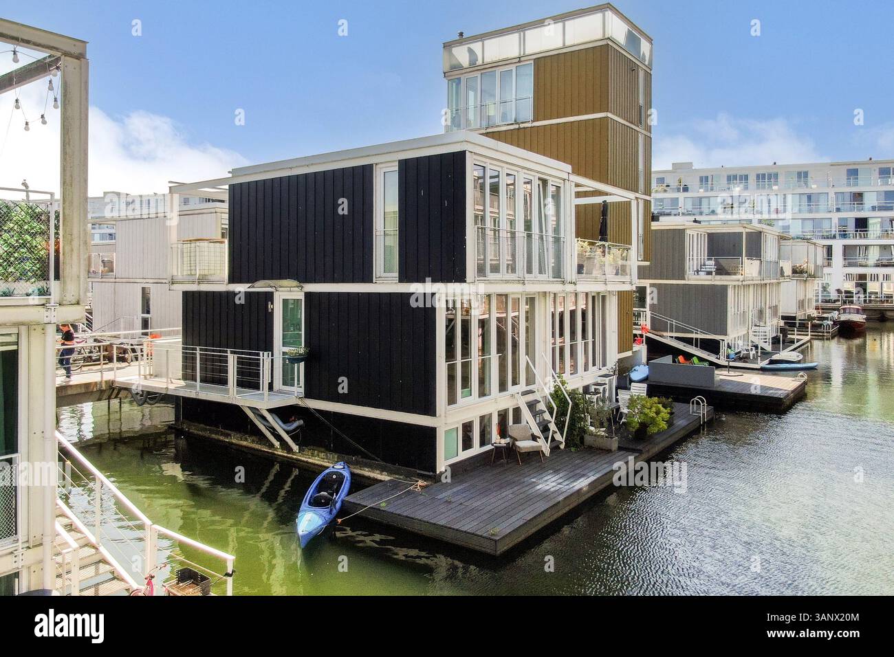 Elegant floating homes showcasing contemporary architecture, surrounded ...