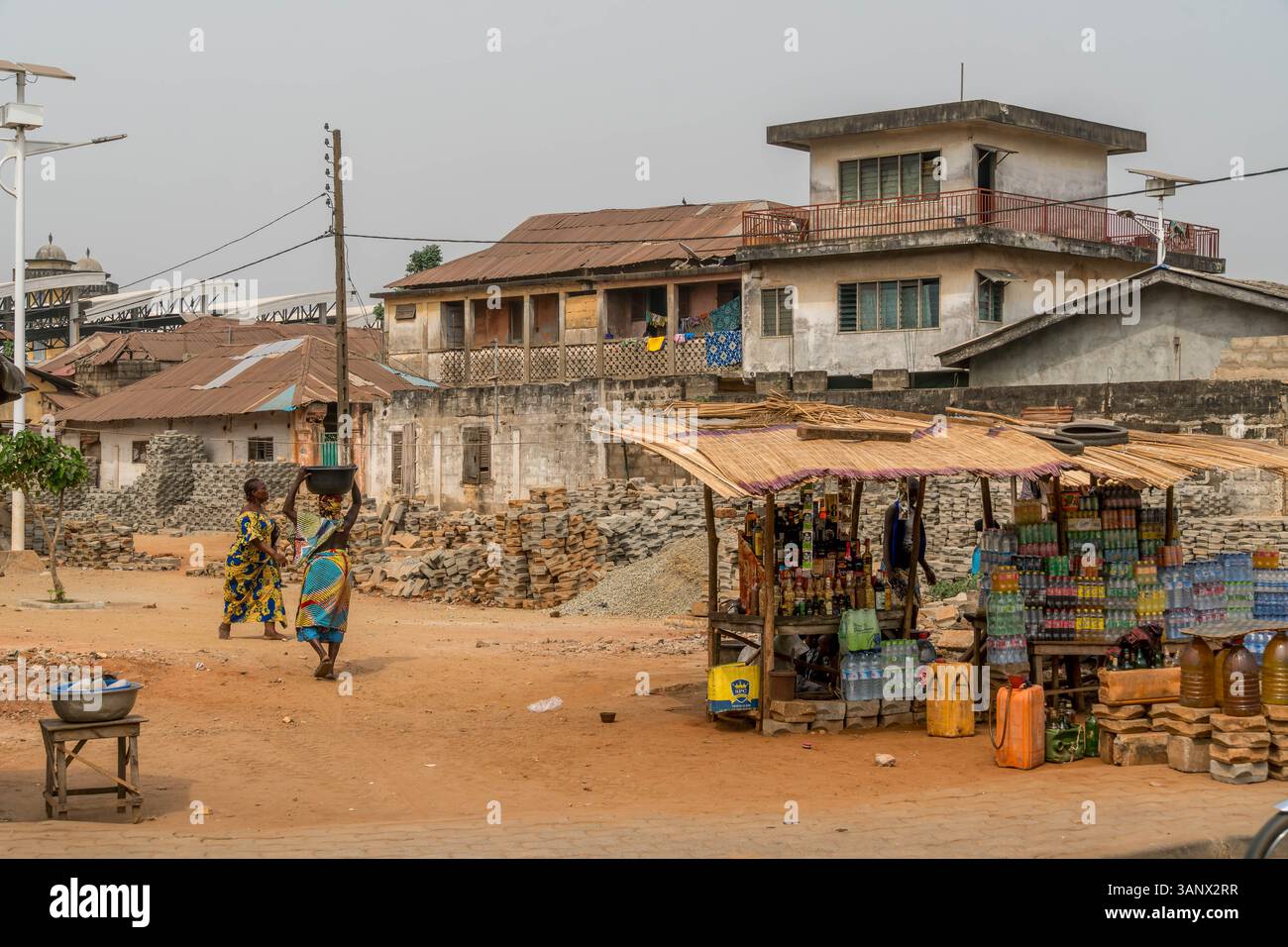 Street in Porto-Novo, Benin, featuring poverty, shops, poor ...