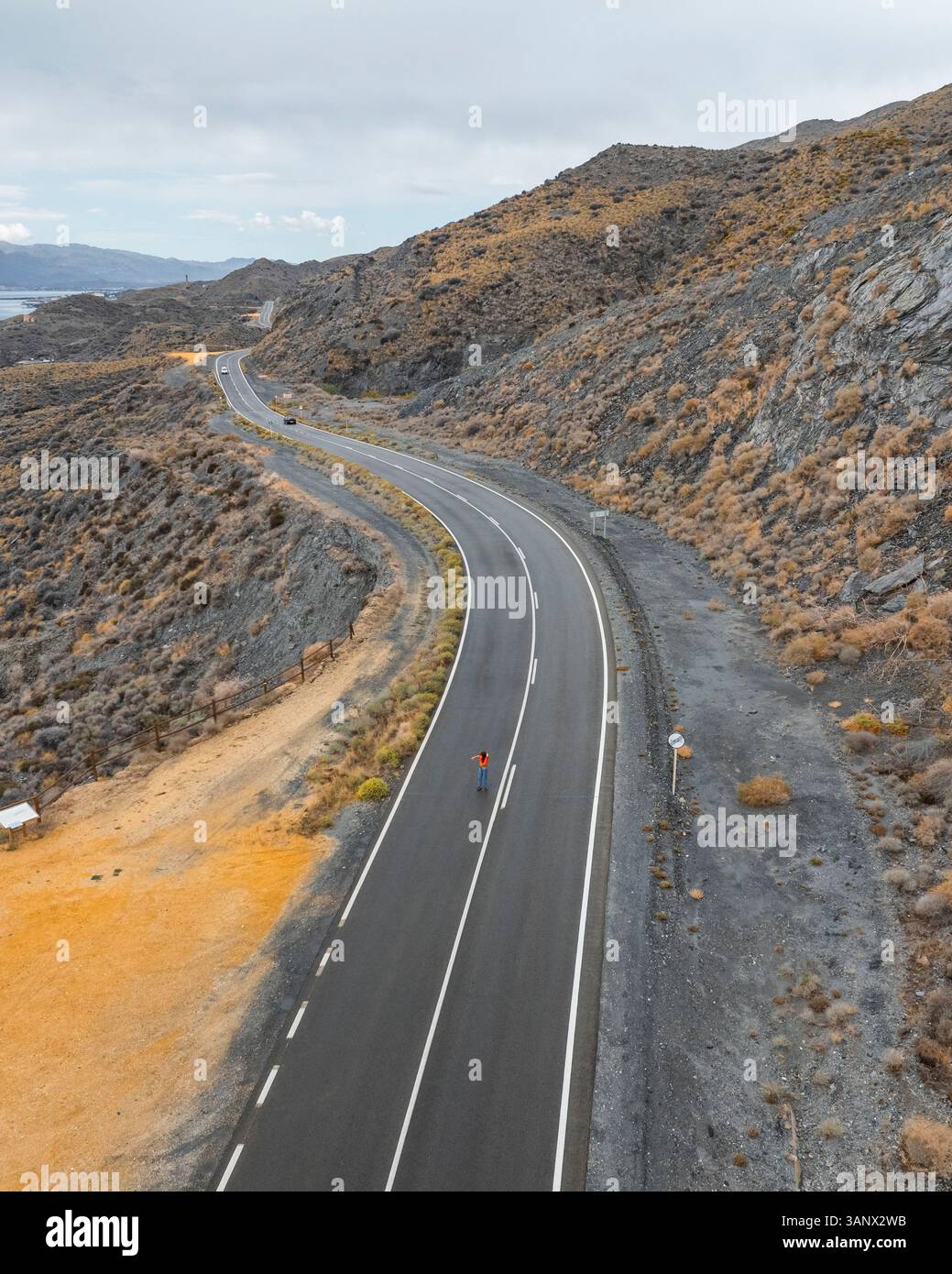 Aerial view of Cala Concha with road and woman, Cuevas del Almanzora ...