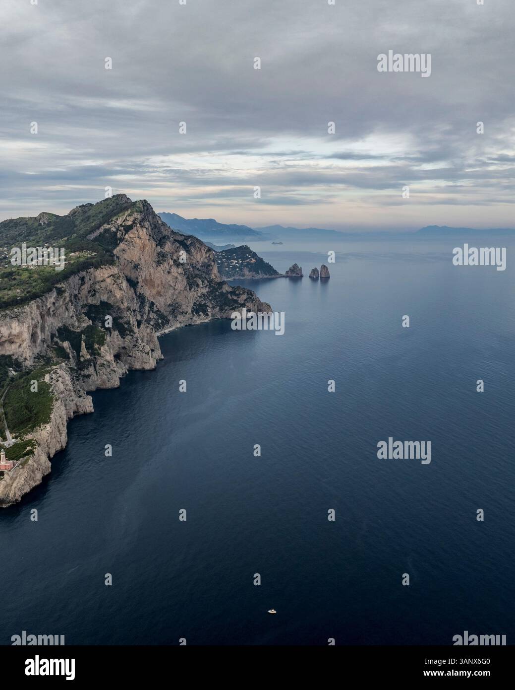 Aerial view of beautiful sunset over rocky coast of Capri Island ...