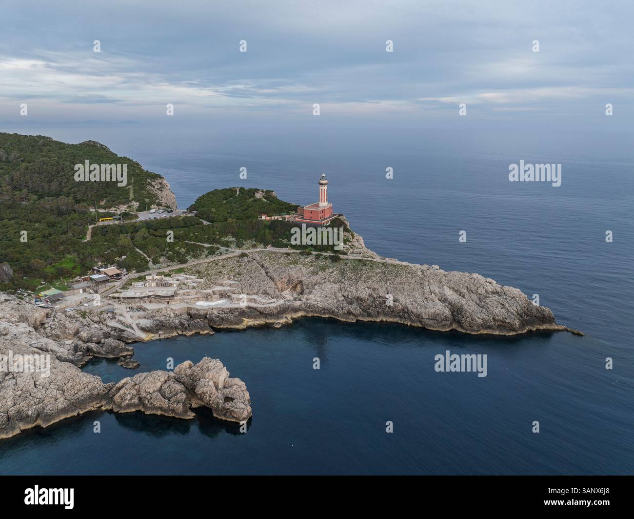 Aerial view of natural landscape with lighthouse overlooking the ocean ...