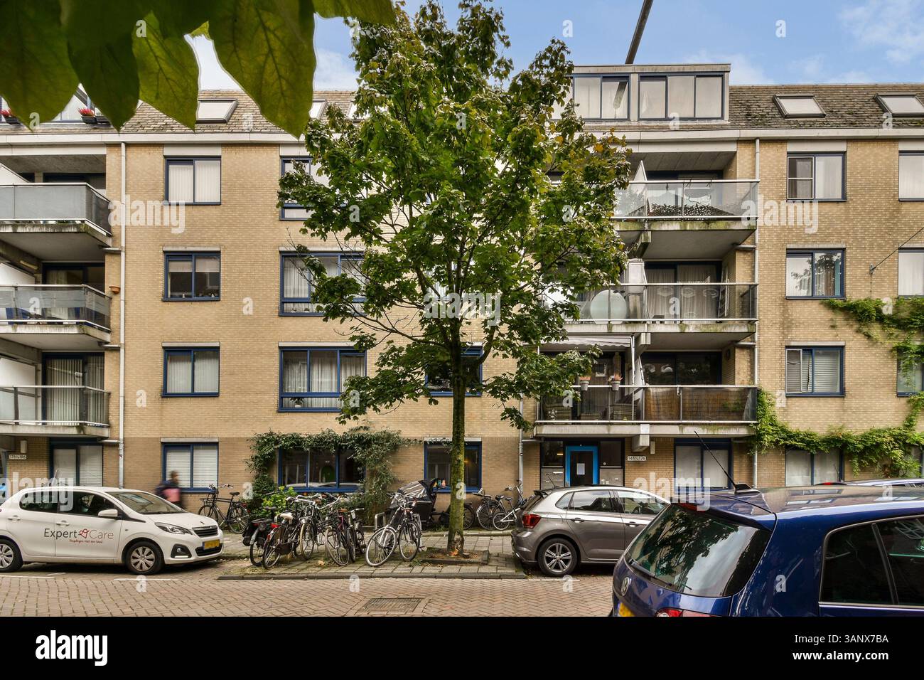 A contemporary apartment complex featuring multiple balconies ...