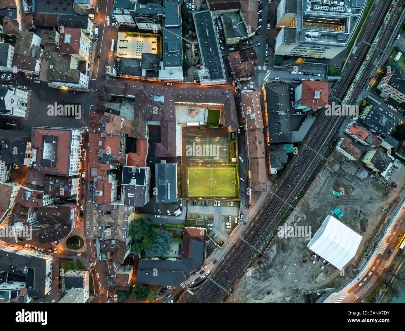 Aerial view of Trento cityscape with illuminated historic buildings and ...