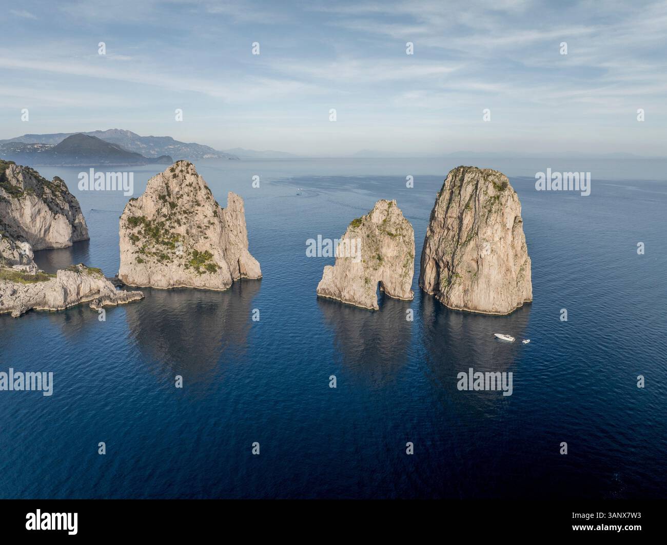 Aerial view of Faraglioni rocks and boats, Capri Island, Naples, Italy ...