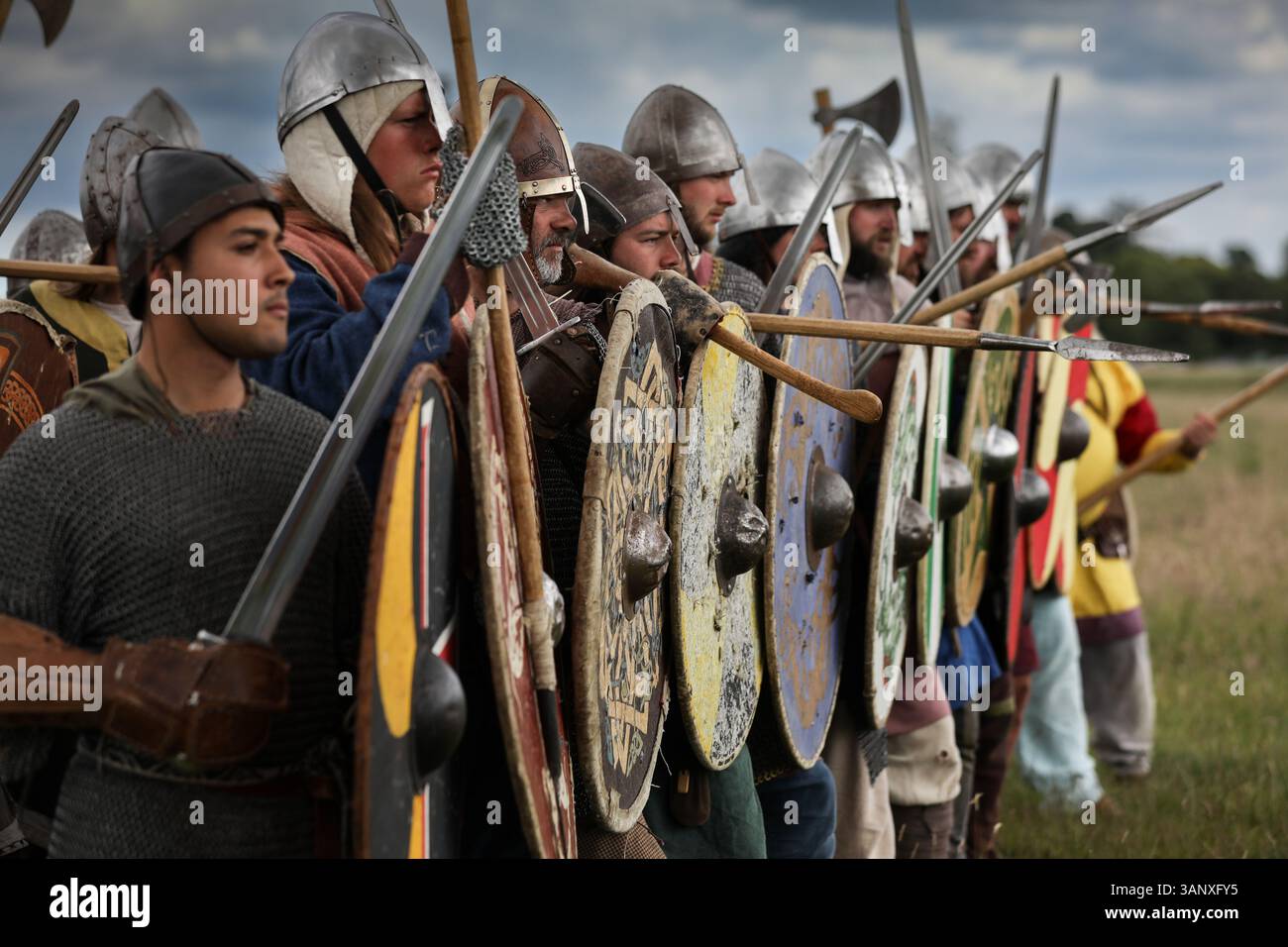 Viking reenactment group shield wall Stock Photo - Alamy