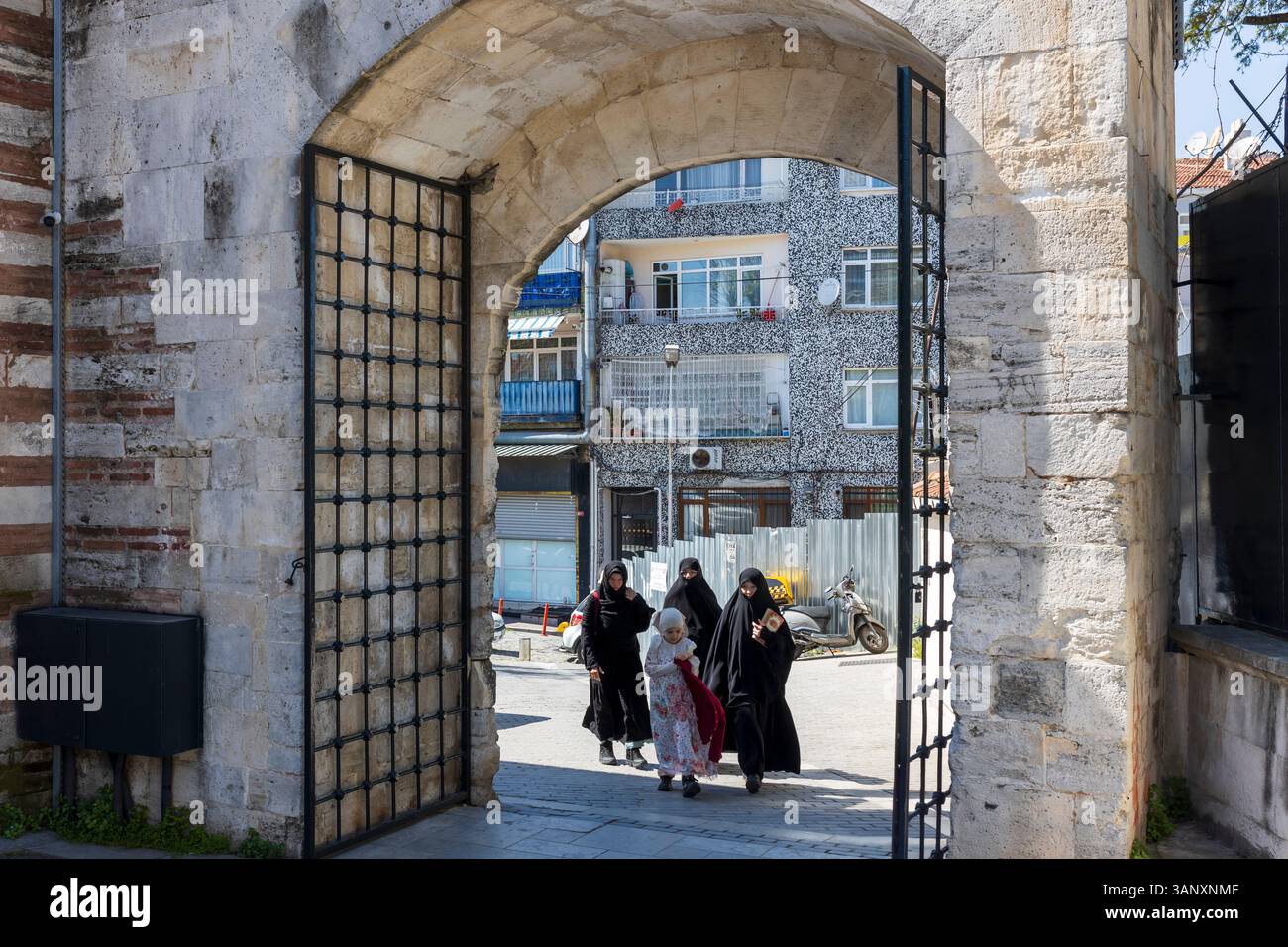 Istanbul, Turkey, 5 April 2024, Stone archway with a metal gate opens ...