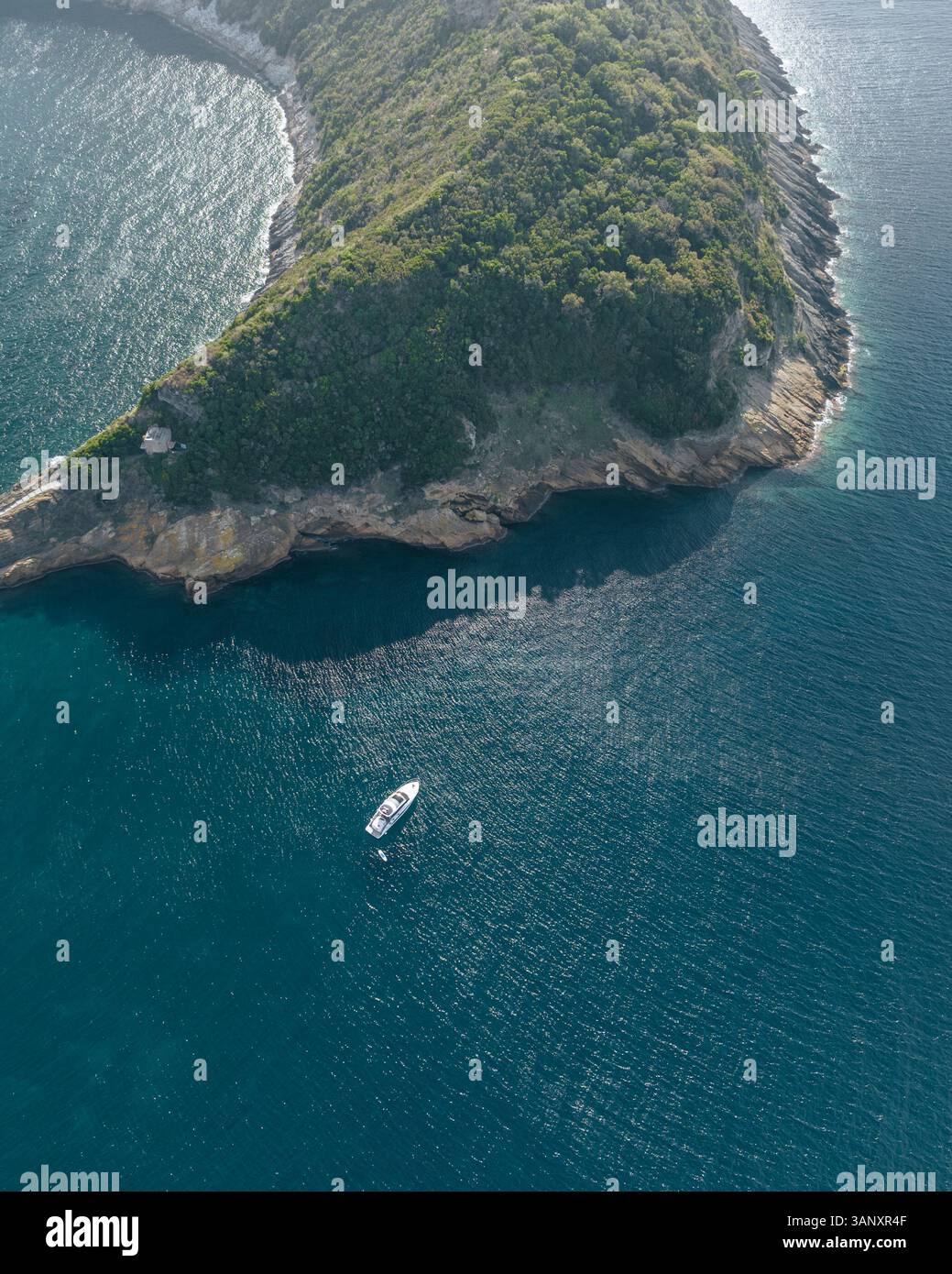 Aerial view of a sailboat moored in front of Vivara island natural ...