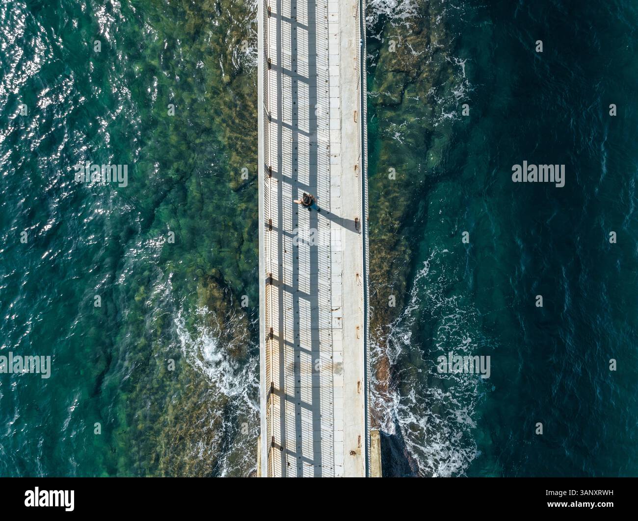 Aerial view of a woman walking on Vivara bridge connecting Vivara ...