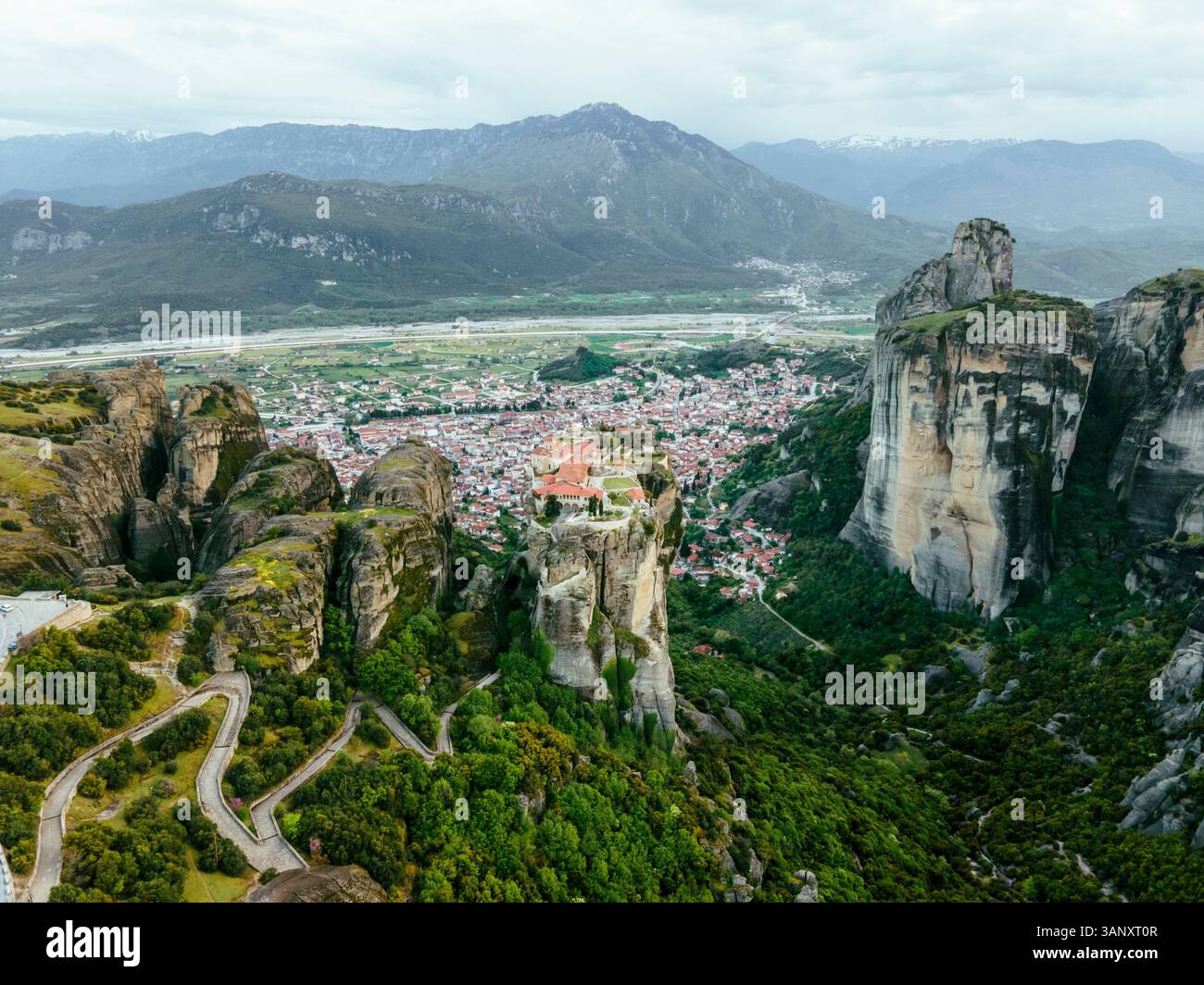 Aerial view of The Holy Trinity Orthodox Monastery with Kalabaka town ...