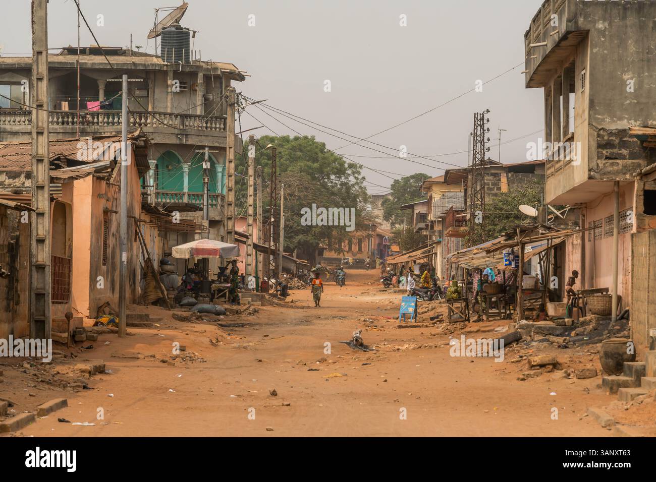 Dusty street scene in Porto-Novo, Benin, with local people, market ...