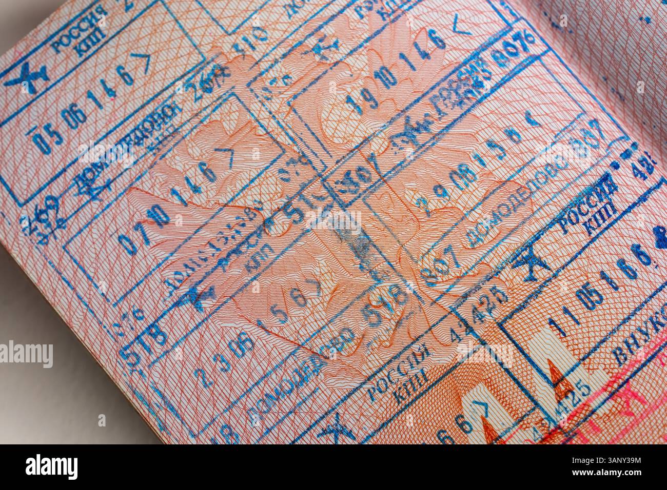 Travel passport with multiple visa stamps, entry and exit marks, border ...