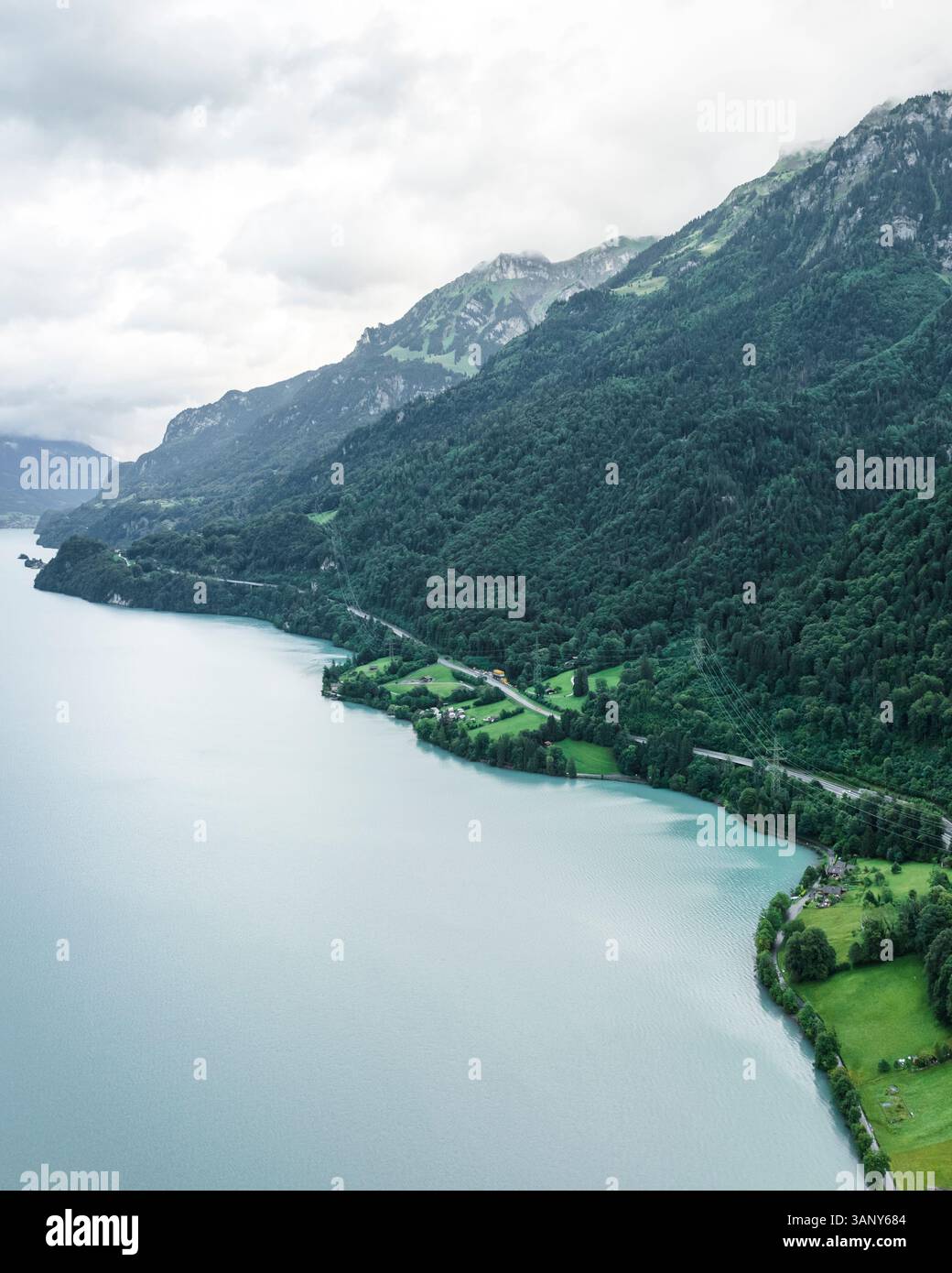 Aerial view of a road following the Brienzersee Lake coastline, Bonigen ...