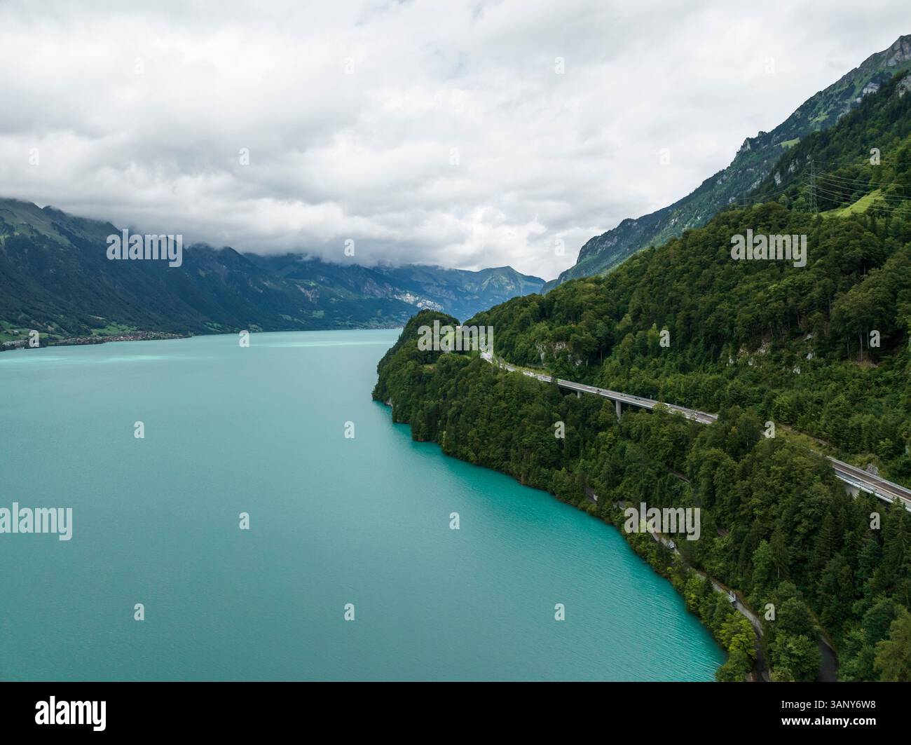 Aerial view of a road following the Brienzersee Lake coastline, Bonigen ...