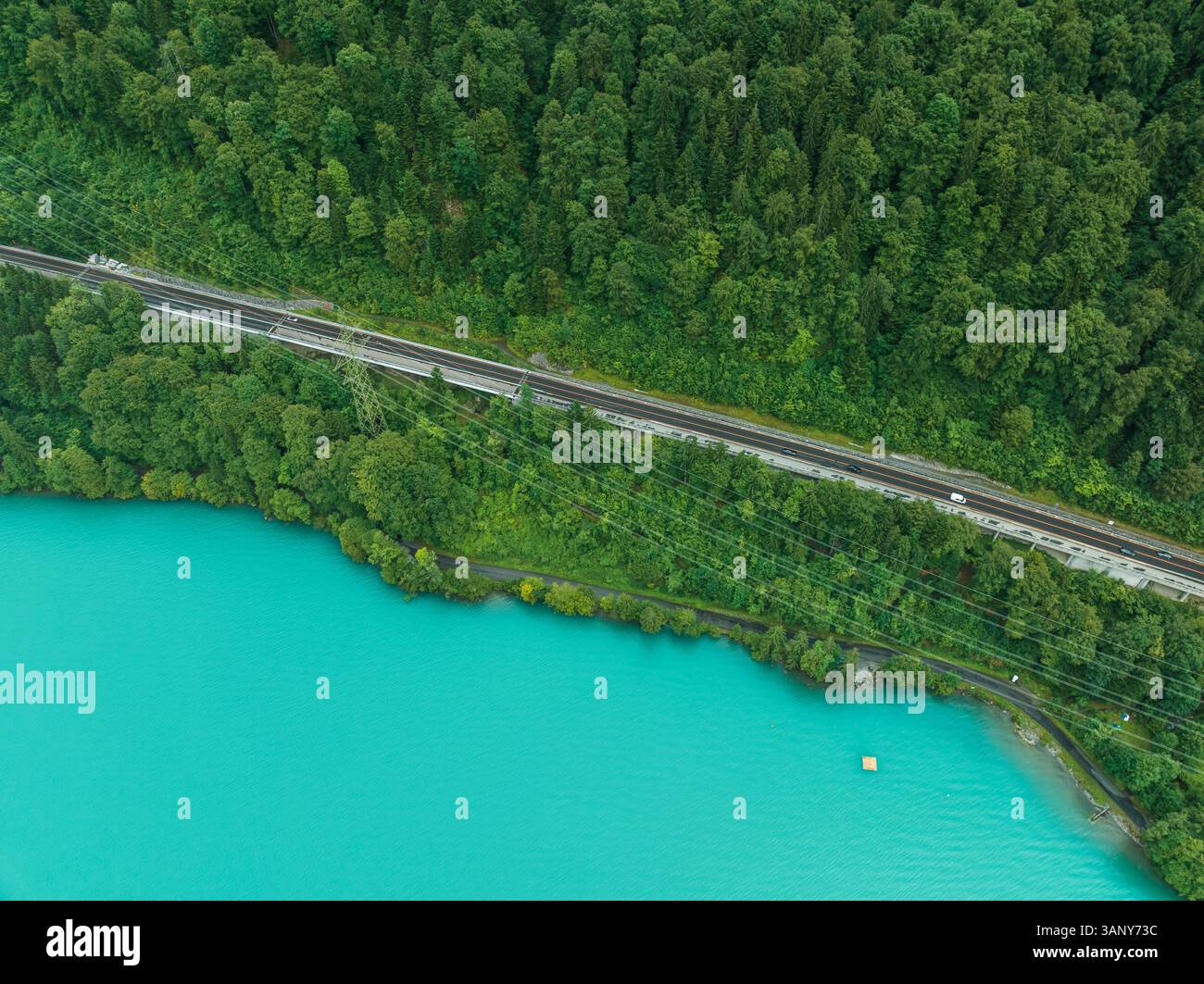 Aerial view of a road following the Brienzersee Lake coastline, Bonigen ...