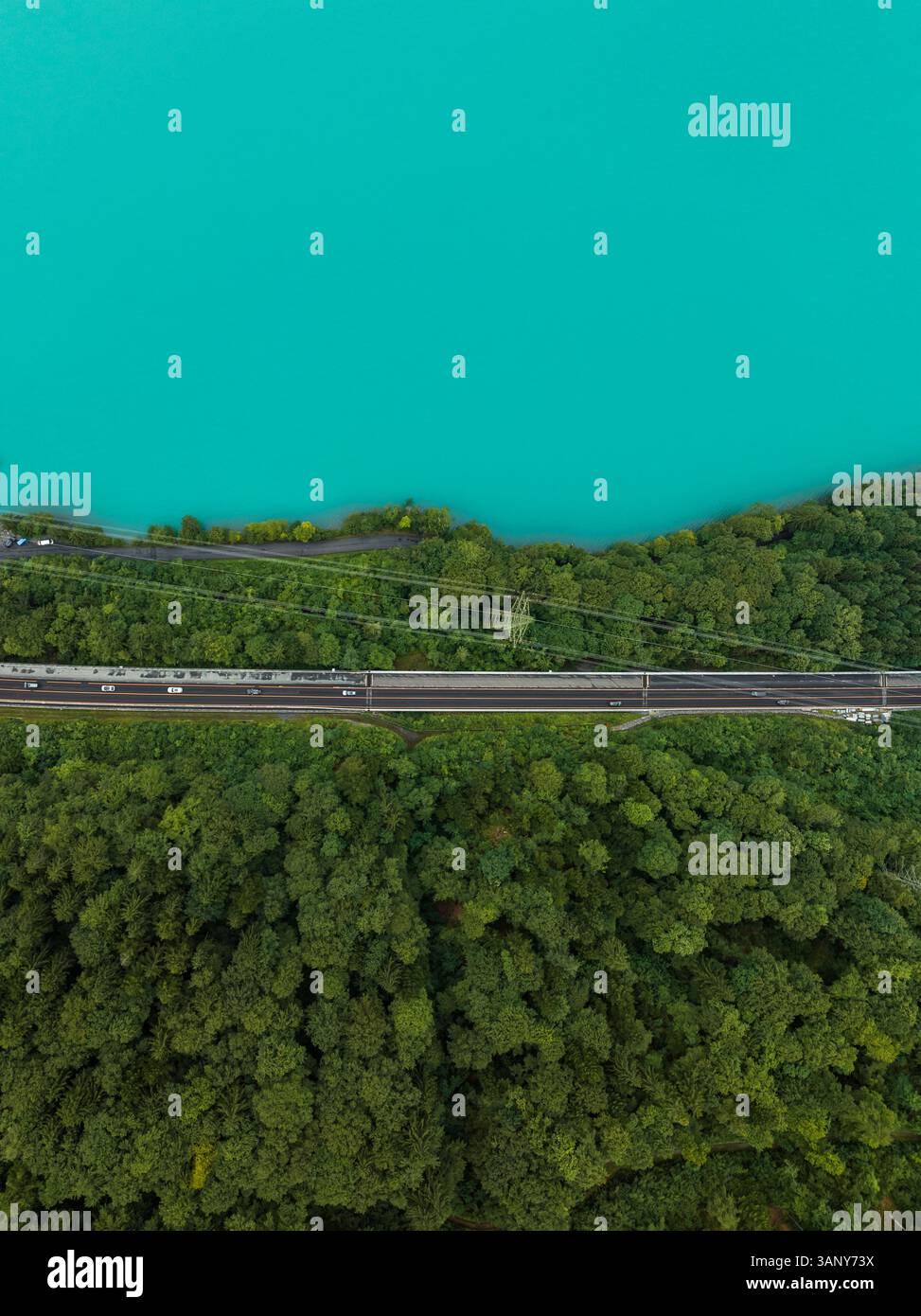 Aerial view of a road following the Brienzersee Lake coastline, Bonigen ...